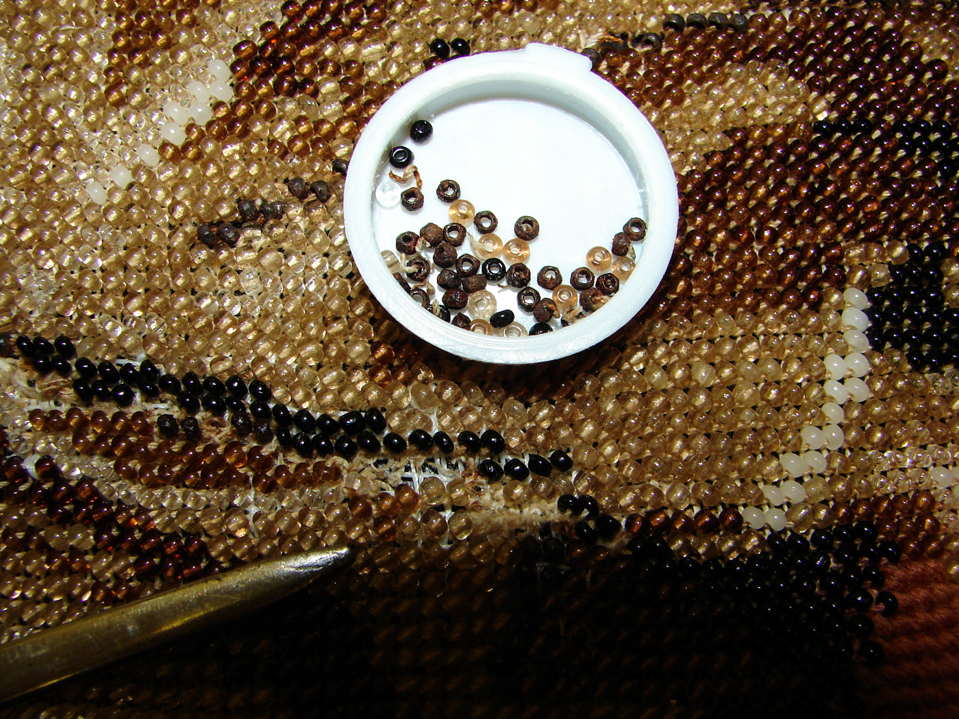 Textile Conservation: Victorian Beaded Angel Needlepoint | MPF Conservation